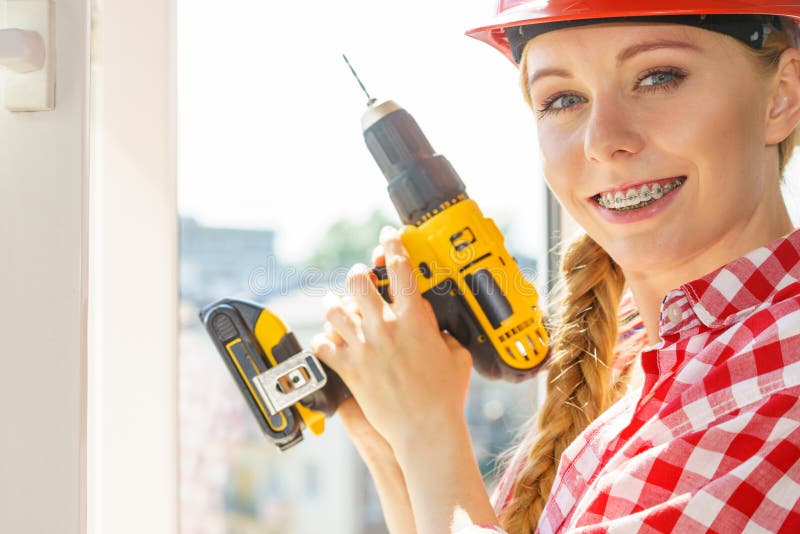 Woman Using Drill To Fix or Installing Windows Stock Photo - Image of ...