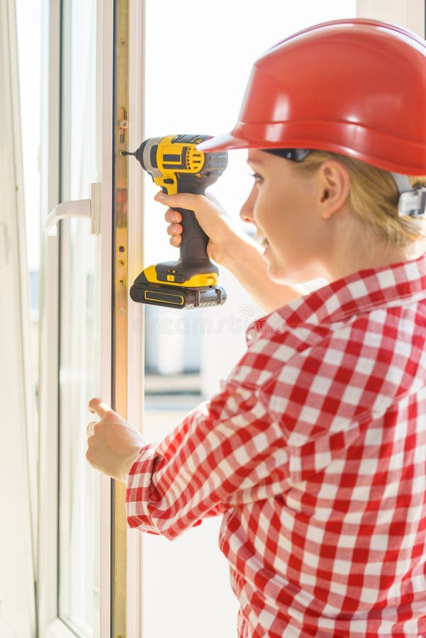 Woman Using Drill To Fix or Installing Windows Stock Image - Image of ...