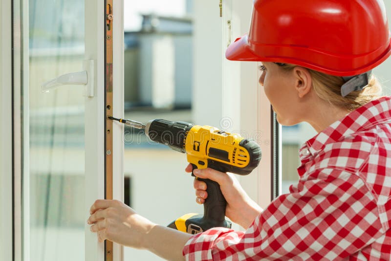 Woman Using Drill on Window Stock Image - Image of indoors, tool: 203150469
