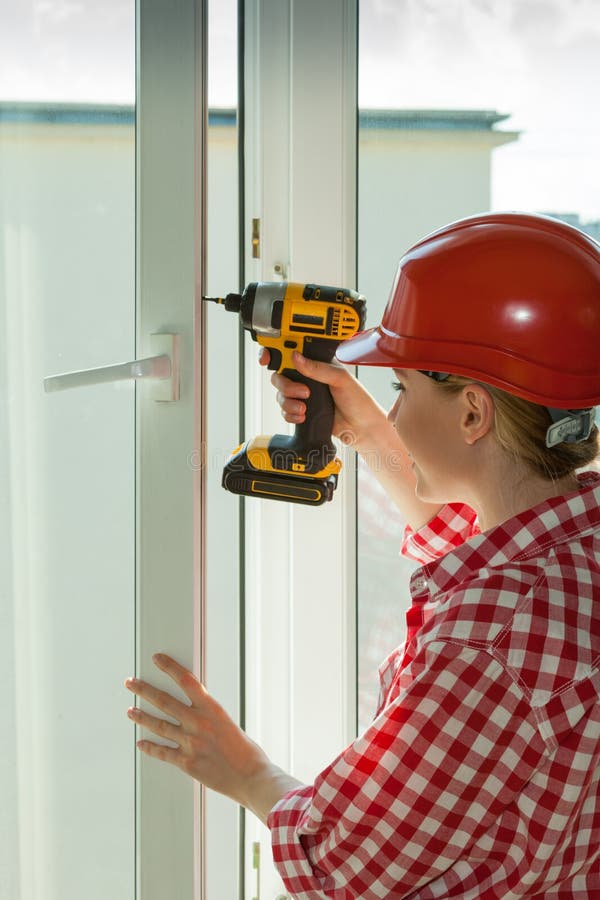 Woman Using Drill on Window Stock Image - Image of build, window: 305275699