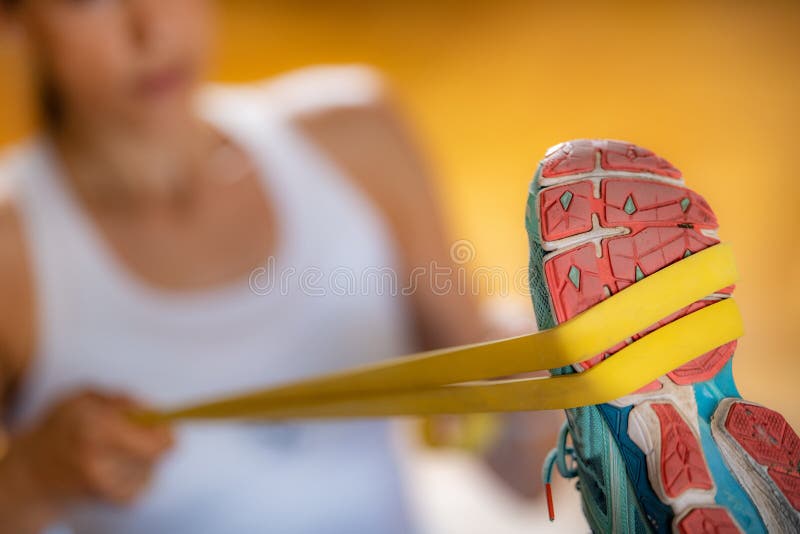 Woman Using Elastic Band for Stretching after Training Stock Image ...