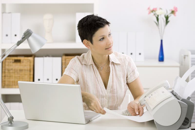 Woman using fax machine stock photo. Image of horizontal - 7674122