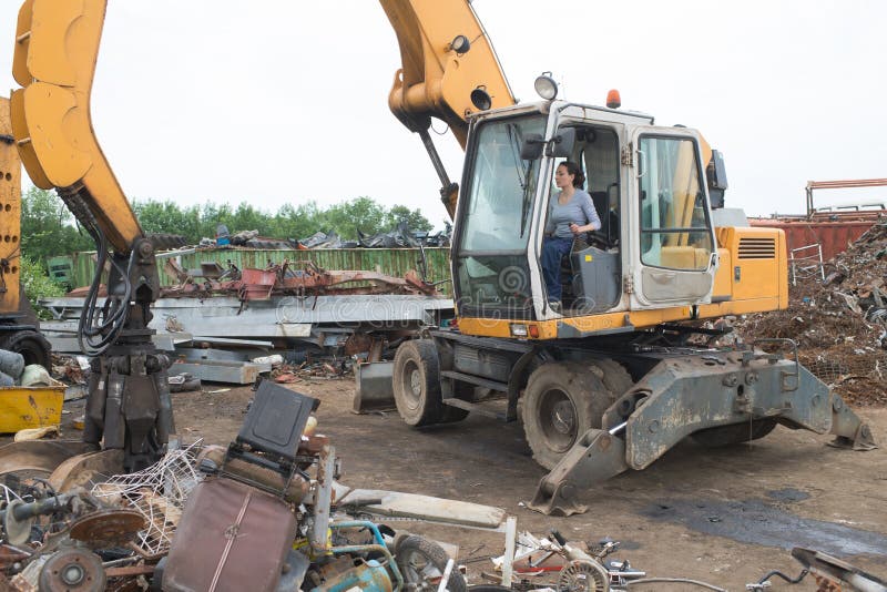 Woman Using Grabber in Scrapyard Stock Image - Image of platform, plant ...