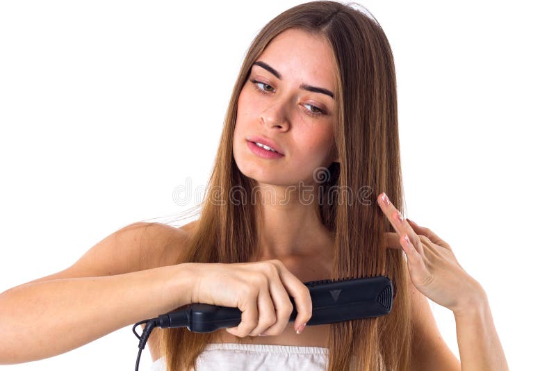 Woman Using Hair Straightener Stock Photo - Image of woman, person ...