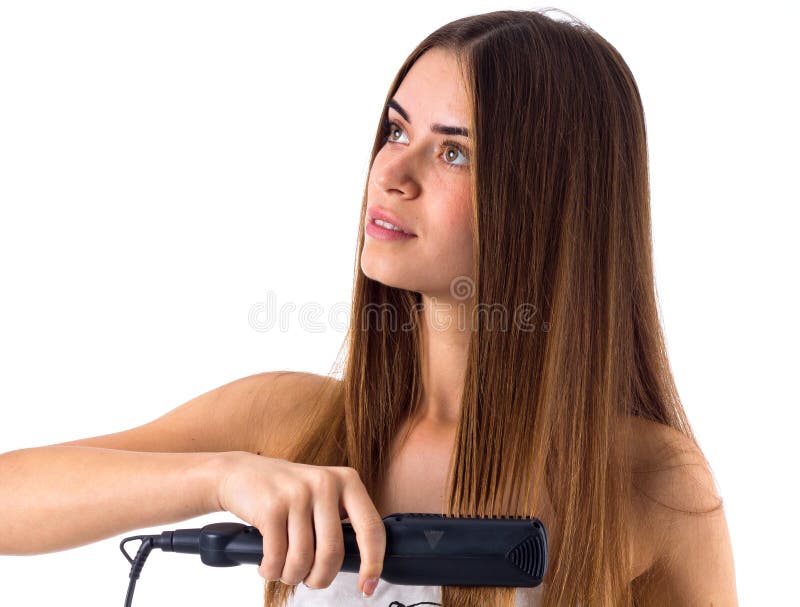 Woman Using Hair Straightener Stock Photo - Image of woman, person ...