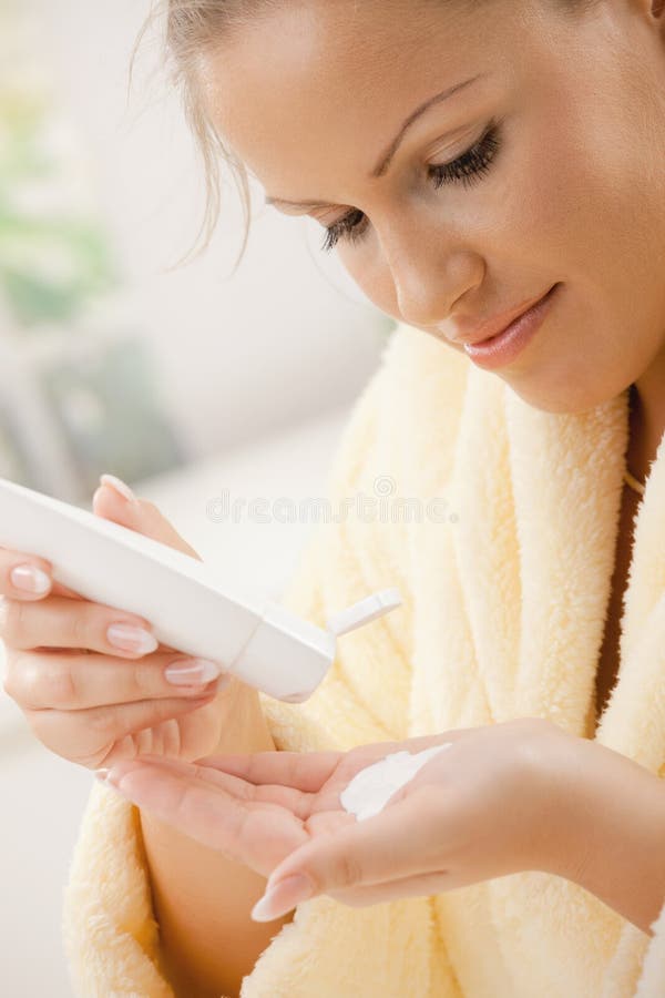 Woman using hand cream stock image. Image of feminine - 11992849