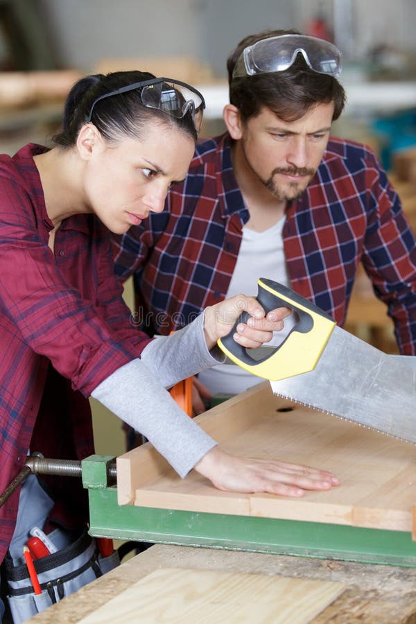 Two Person Using Hand Saw Stock Photos - Free & Royalty-Free Stock ...