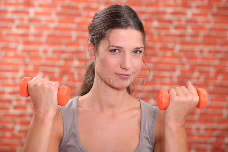 Woman using hand weights stock image. Image of healthy - 30563233