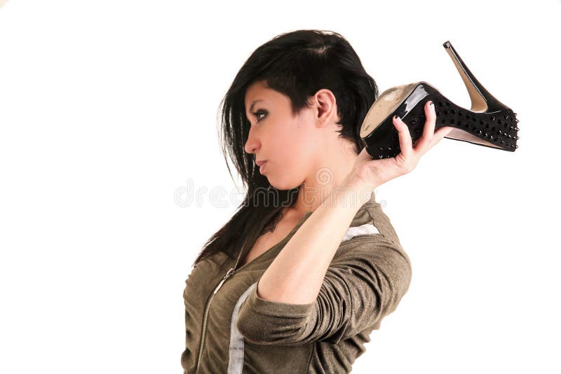 Woman Using a Heel Shoe As Weapon Stock Photo - Image of aggressiveness ...