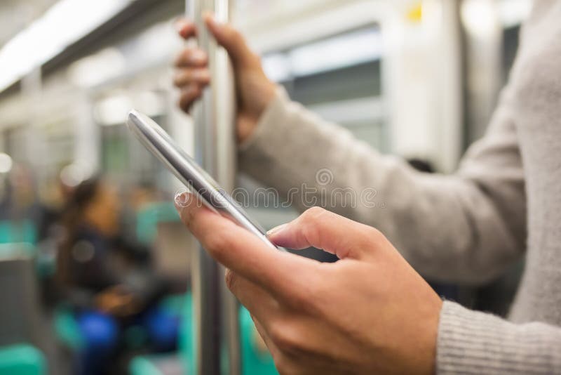 Woman Using Mobile Phone while Shopping in Supermarket Stock Photo ...