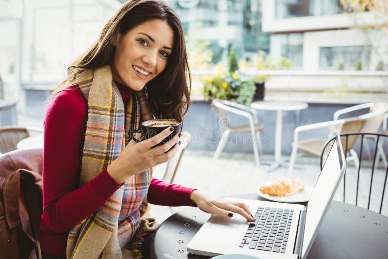 Woman Using Her Laptop and Drinking Coffee Stock Image - Image of ...