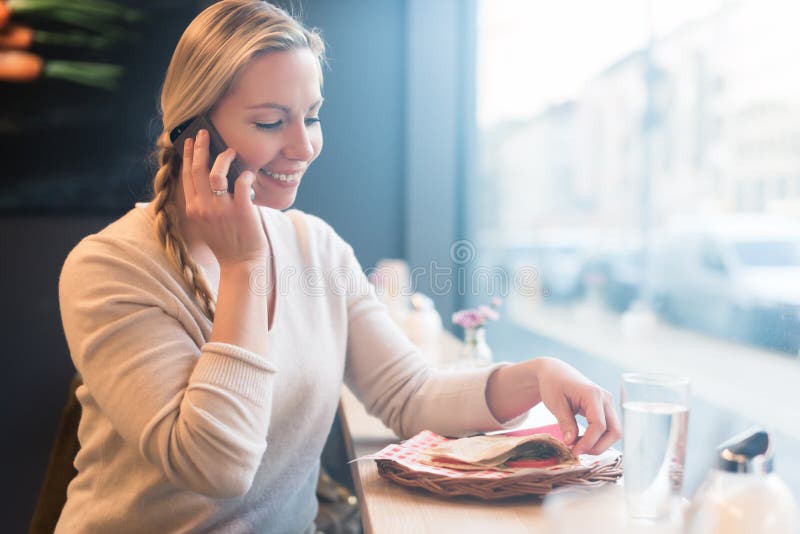 Woman Using Her Phone in Train Cabin To Talk To Friends Stock Image ...