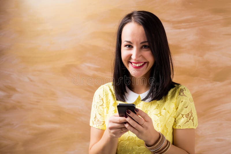 Woman using her smartphone stock image. Image of smart - 65350823