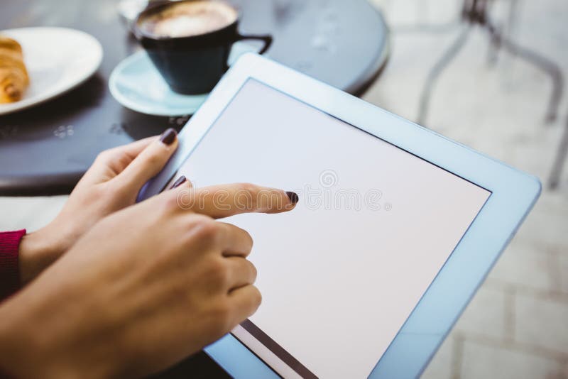 Woman using her tablet stock photo. Image of beverage - 66975084