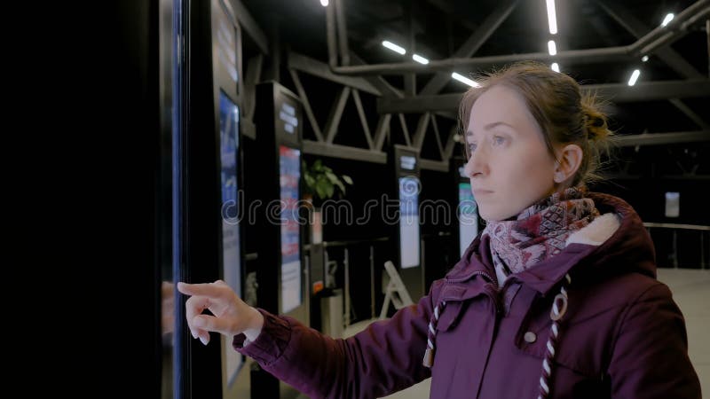 Woman Using Interactive Touchscreen Display of Electronic Multimedia ...