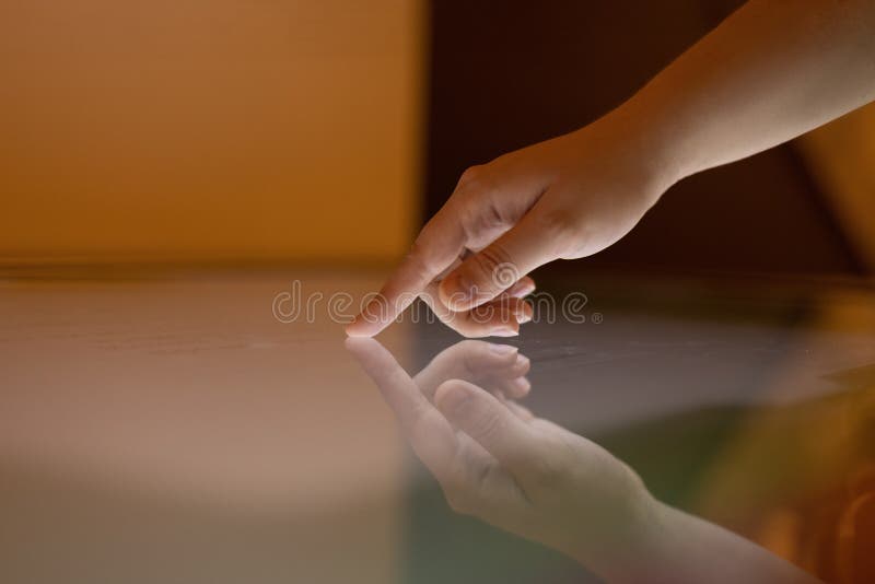 Woman Using Interactive Touchscreen Display Table at Urban Exhibition ...