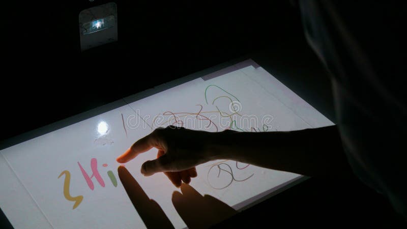 Woman Using Interactive Touchscreen Projector Display for Drawing Stock ...