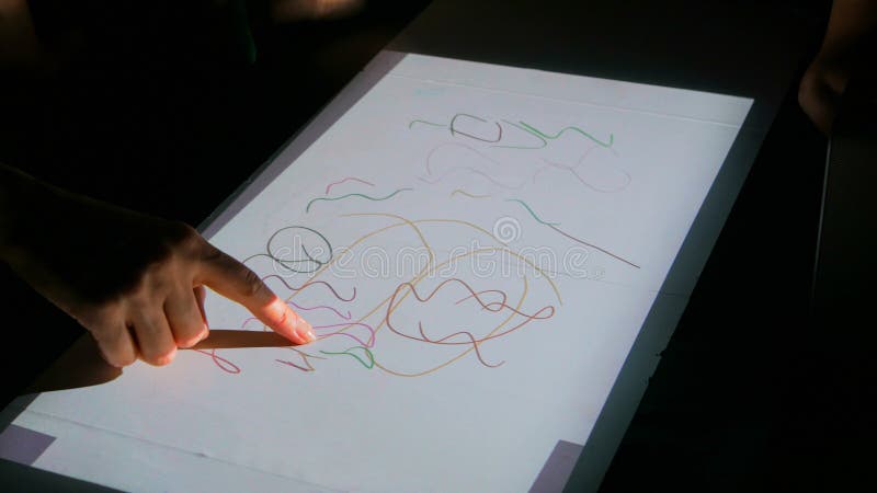 Woman Using Interactive Touchscreen Projector Display for Drawing Stock ...