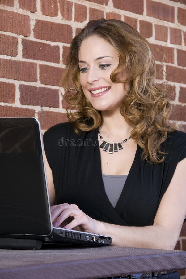 Woman Using Laptop stock image. Image of technology, pretty - 13607561