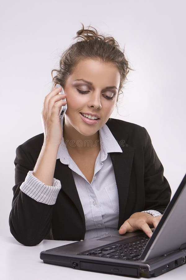 Woman Using a Laptop Computer Stock Photo - Image of phone, modern ...