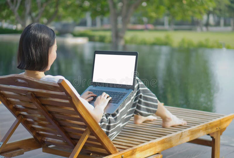 Woman Using Laptop Computer by the Pool Stock Image - Image of people ...