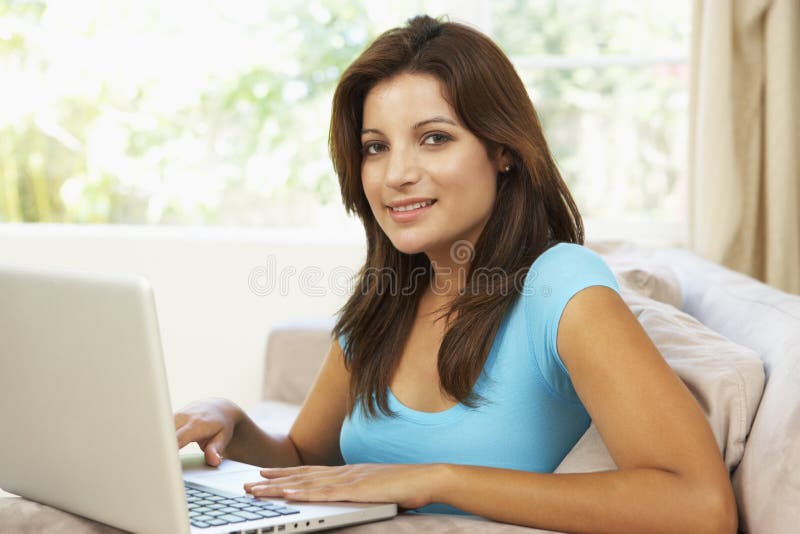 Woman Using Laptop at Home stock image. Image of techno - 12406025