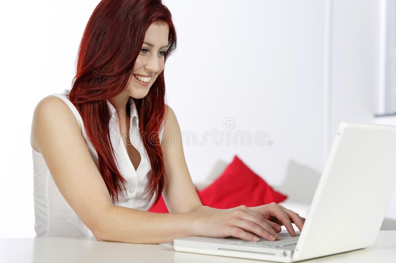 Woman using laptop at home stock image. Image of hair - 25673545
