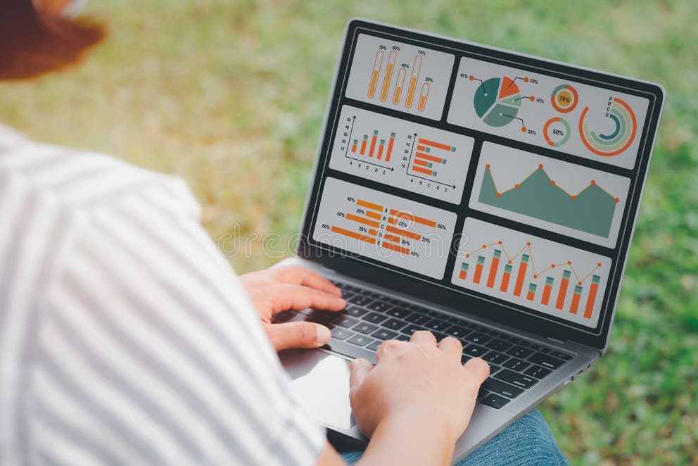 Woman Using Laptop or Notebook Computer with Data Analysis Graph ...