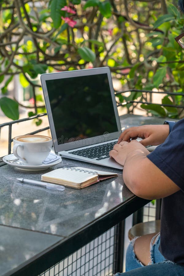 Woman Using Laptop at Outdoor Bar Table at Beautiful Coffeeshop Stock ...