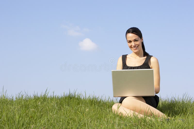 Woman Using Laptop Outdoors in Summer Countryside Stock Photo - Image ...