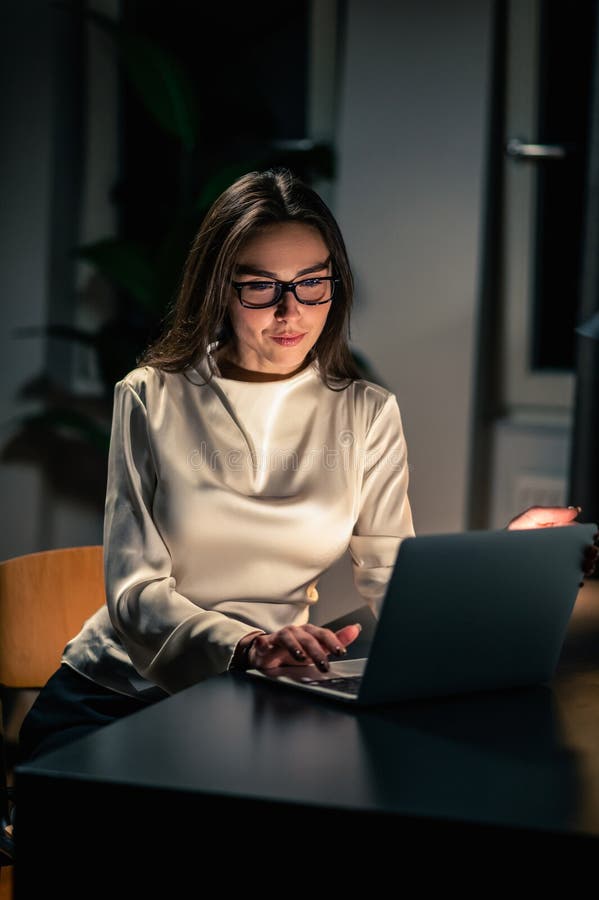 Woman Using Laptop for Remote Working at Home at Night in Dark Room ...