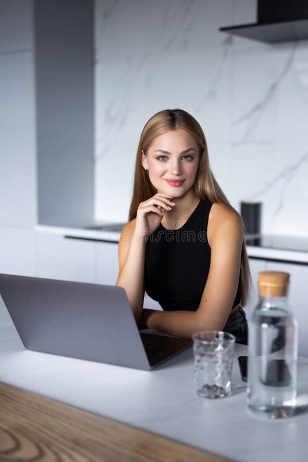 Young Woman Using Laptop while Sitting at Home Stock Image - Image of ...