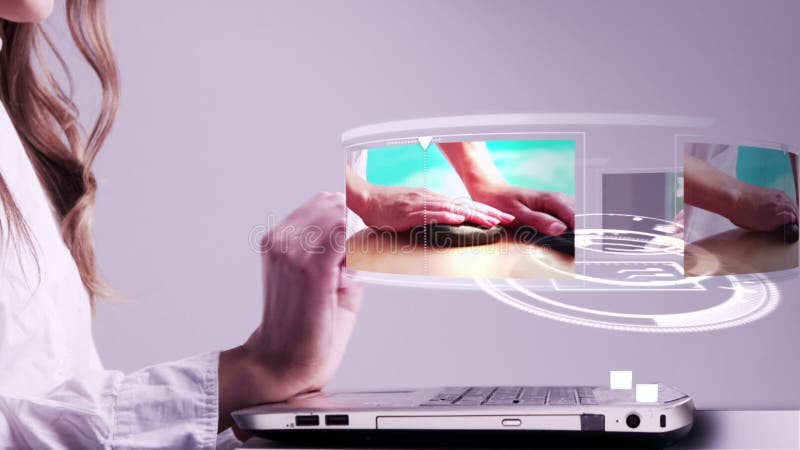 Woman Using Laptop with Spa Hologram Interface Stock Footage - Video of ...