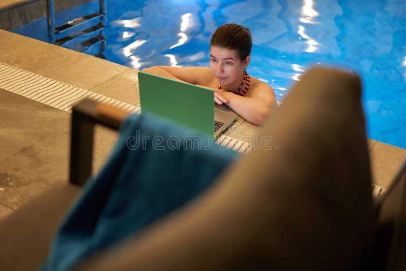 Woman Using Laptop by Swimming Pool Edge Stock Image - Image of meeting ...