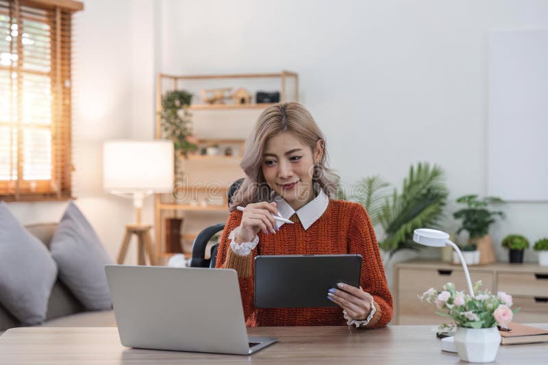 Woman Using Laptop and Tablet on Desk of Her at Home Stock Image ...