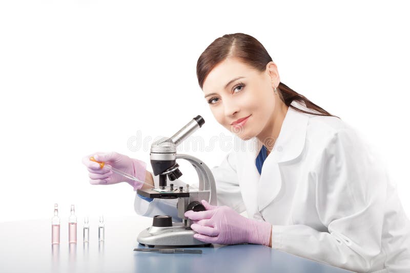 Woman Using a Microscope in a Laboratory. Stock Photo - Image of ...