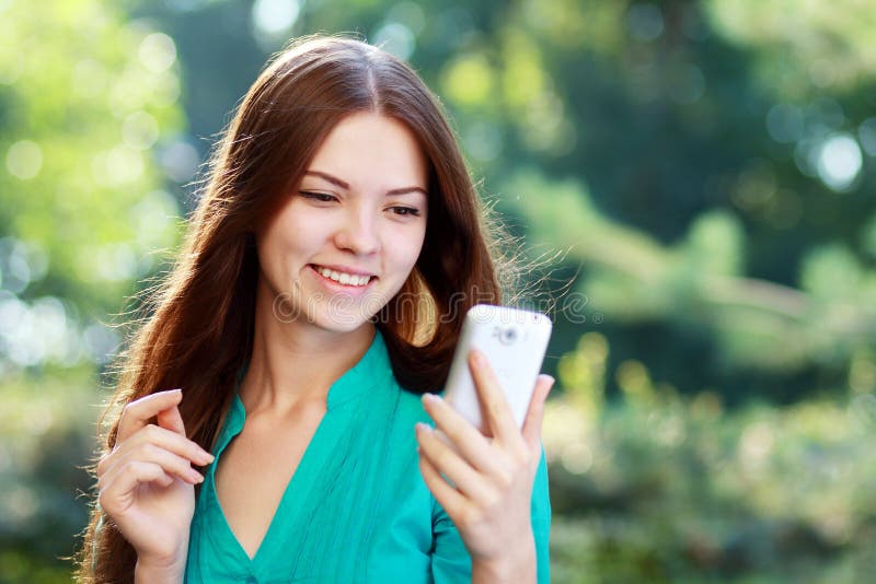 Woman using mobile stock image. Image of people, jeans - 33554313