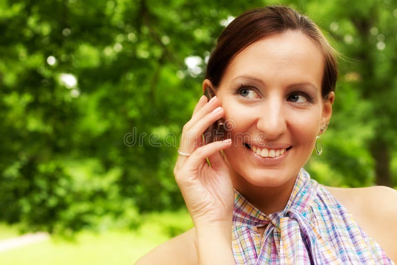 Woman using mobile phone stock photo. Image of natural - 12299834