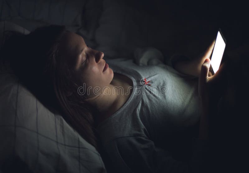 Woman Using Phone in the Dark in Bed Stock Photo - Image of indoor ...