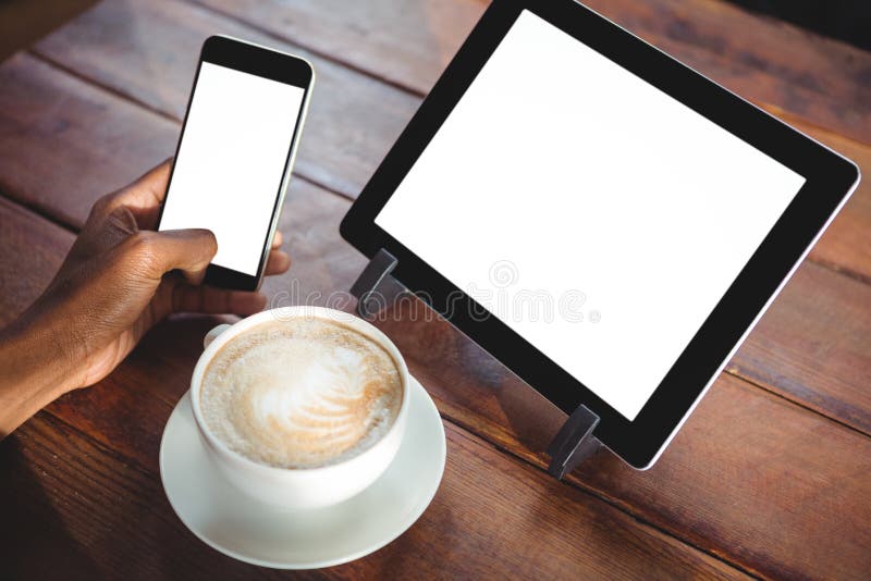 Woman Using Mobile Phone and Digital Tablet in Cafe Stock Photo - Image ...