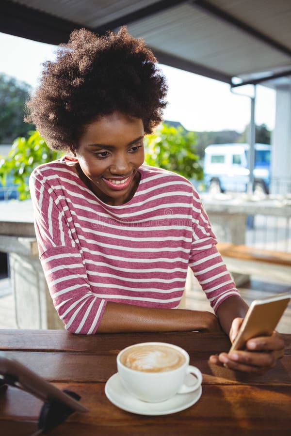 Woman Using Mobile Phone while Having Cup of Coffee Stock Image - Image ...