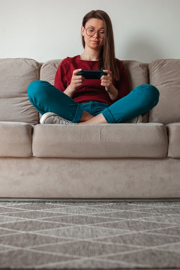 Woman Using Mobile Phone, Holding in Hands Sitting on Sofa Stock Image ...