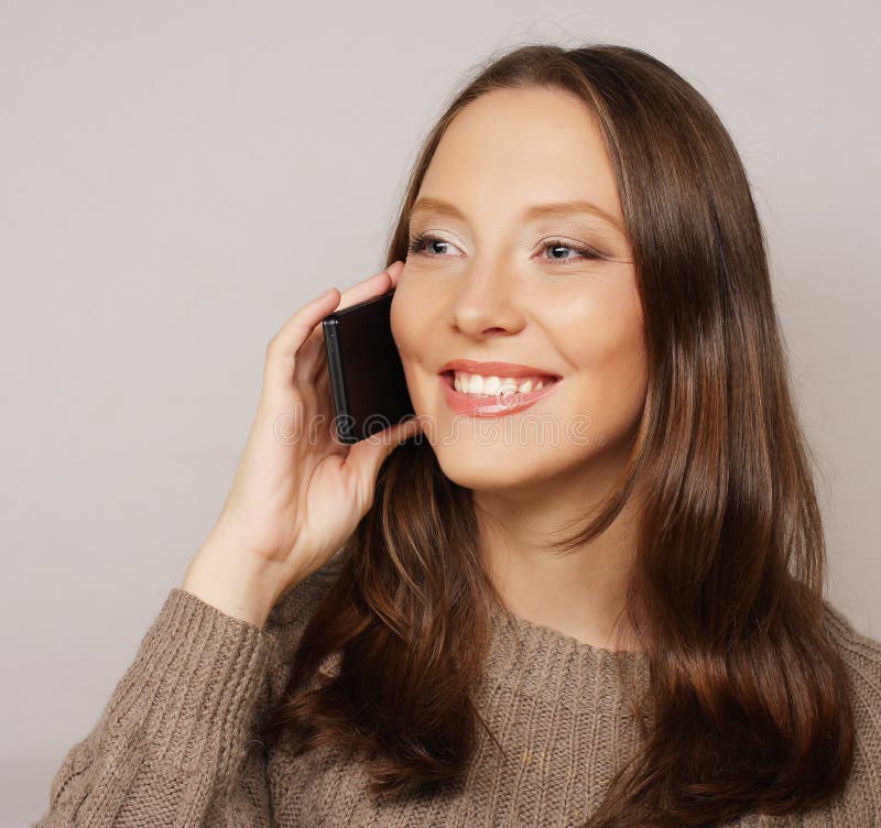 Woman Using a Mobile Phone Isolated on a White Background Stock Photo ... Woman Using a Mobile Phone Isolated on a White Background Stock Photo ...