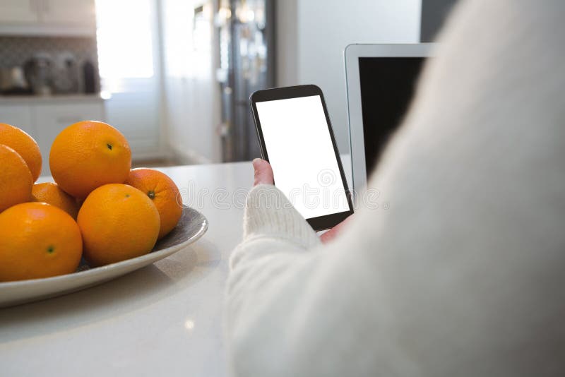 Woman Using Mobile Phone in Kitchen Stock Image - Image of homey, cool ...
