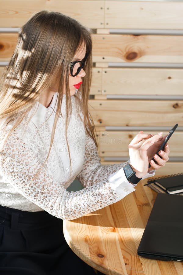Woman Using Mobile Phone and Laptop at Home. Stock Image - Image of ...