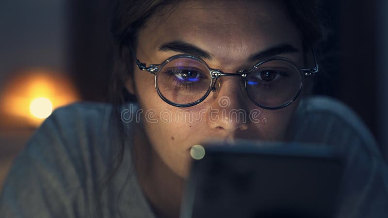 Woman Using Mobile Phone while Laying on Bed Stock Photo - Image of ...