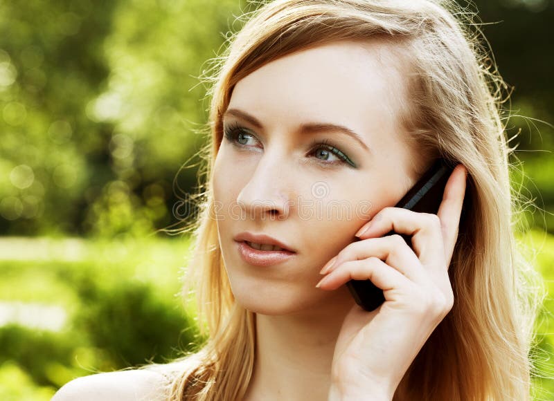 Woman using mobile phone stock image. Image of cute - 130502021