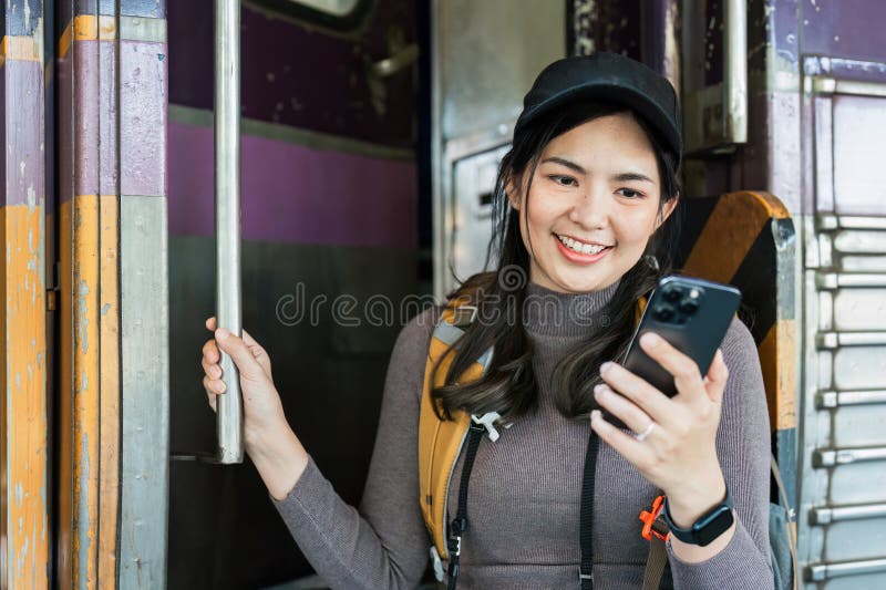 Woman Using Mobile Phone while Travel by Train. Travel Concept Stock ...