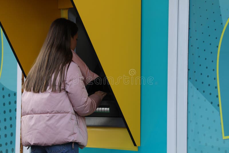 Woman Using Modern Cash Machine Outdoors, Back View Stock Photo - Image ...