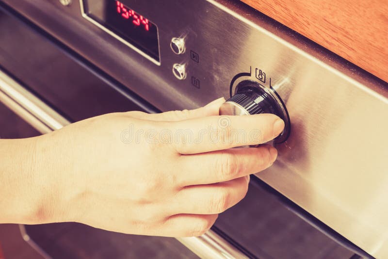 Woman Using Oven Temperature Control Stock Photo - Image of close ...